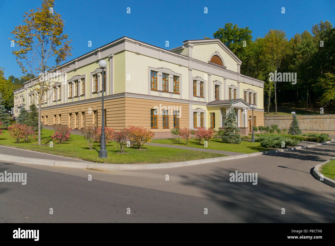 Two-story, two-color school building with a beautiful courtyard with a ...