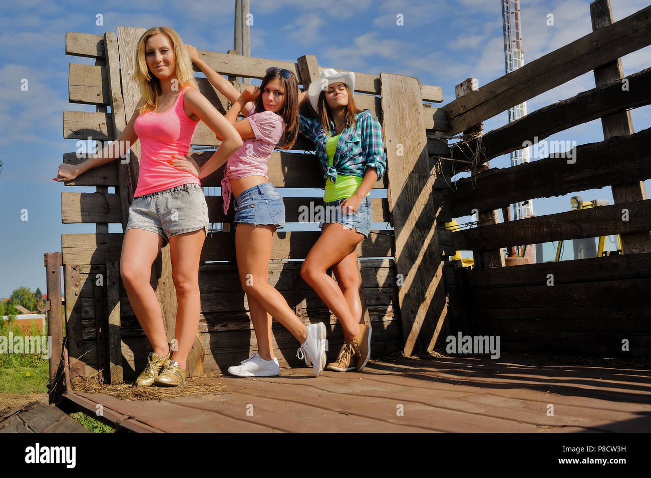 Beautiful women on old big tractor trailer Stock Photo - Alamy