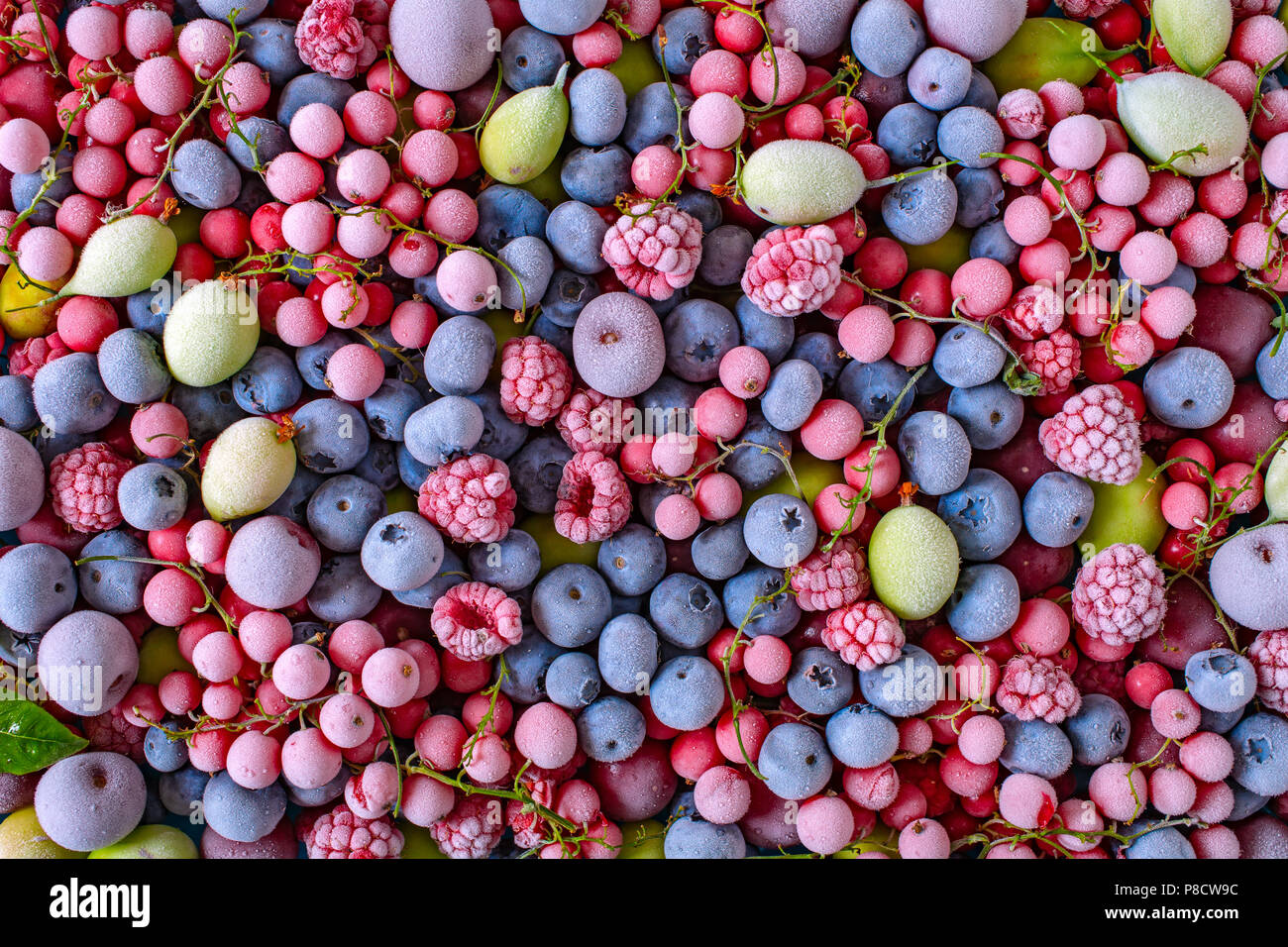 Assorted frozen berries background Stock Photo - Alamy