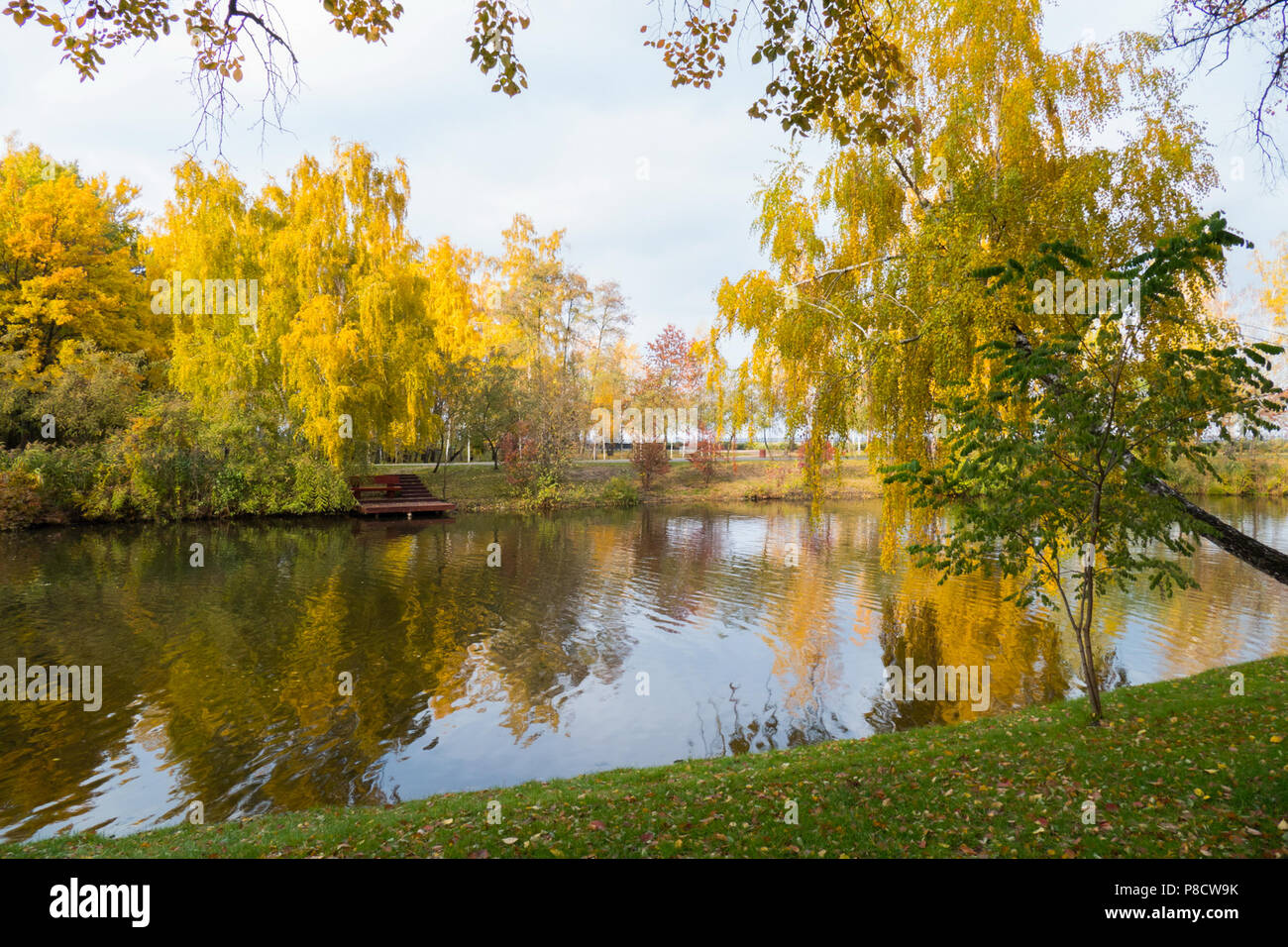 Magnificent view of the transparent lake and bright colors of autumn ...