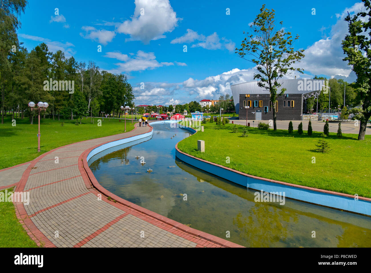 A picturesque long pond near the walking paths in the green park zone ...