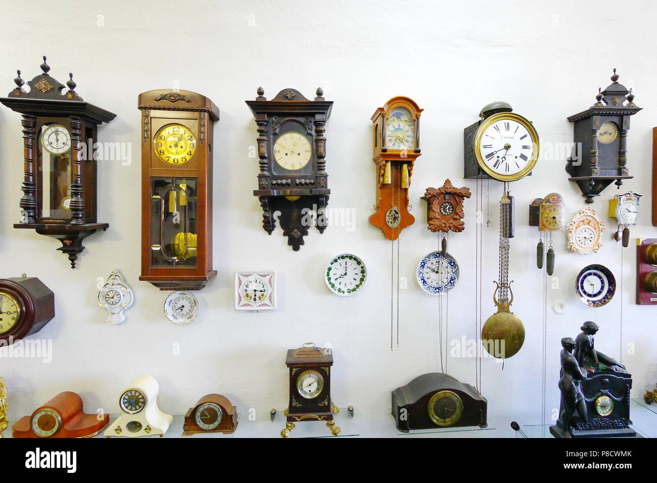 The museum exposition of watches of different sizes, material and gear ...