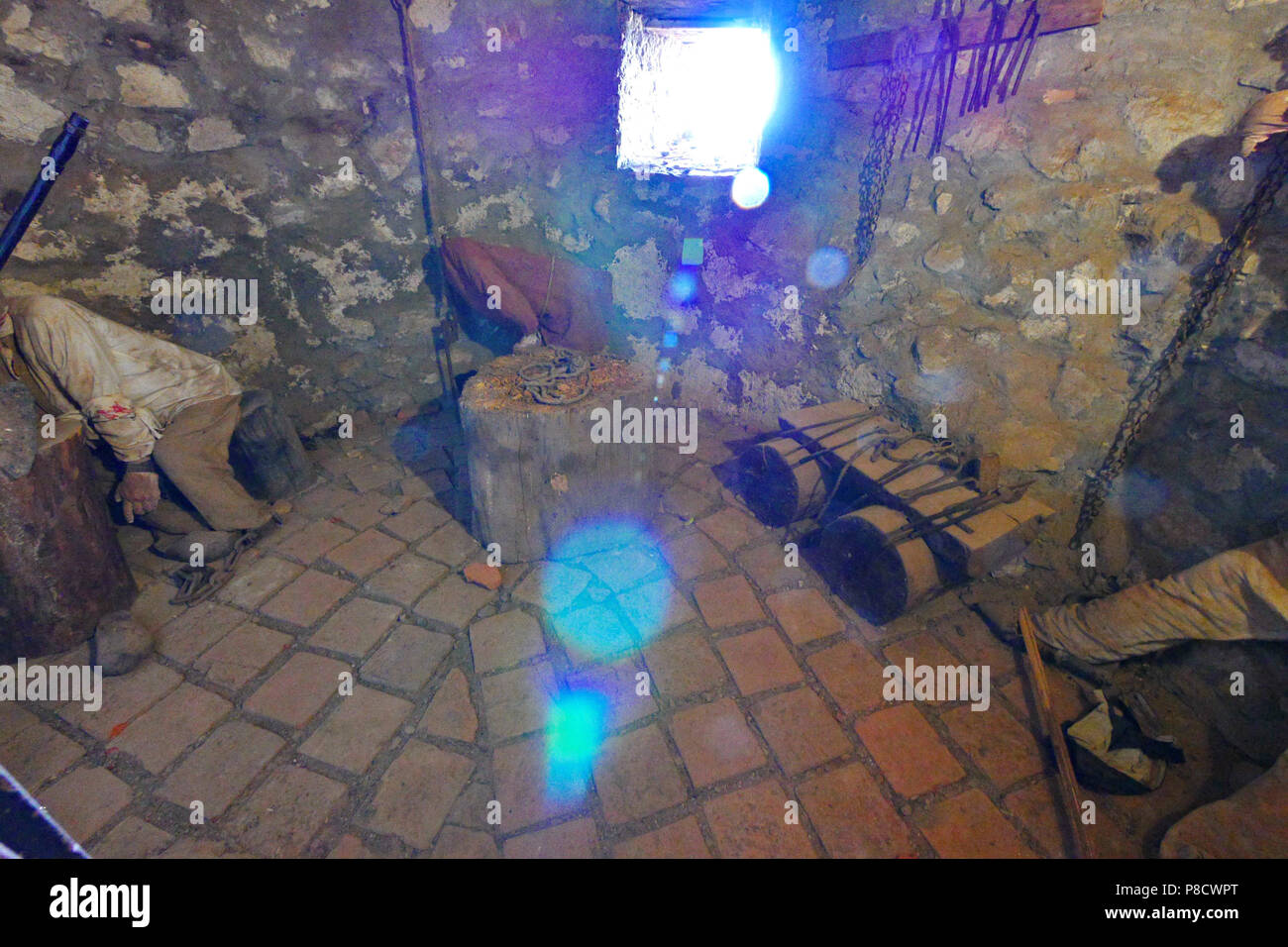 ancient adaptations of a deck with ropes in a small stone room . For ...