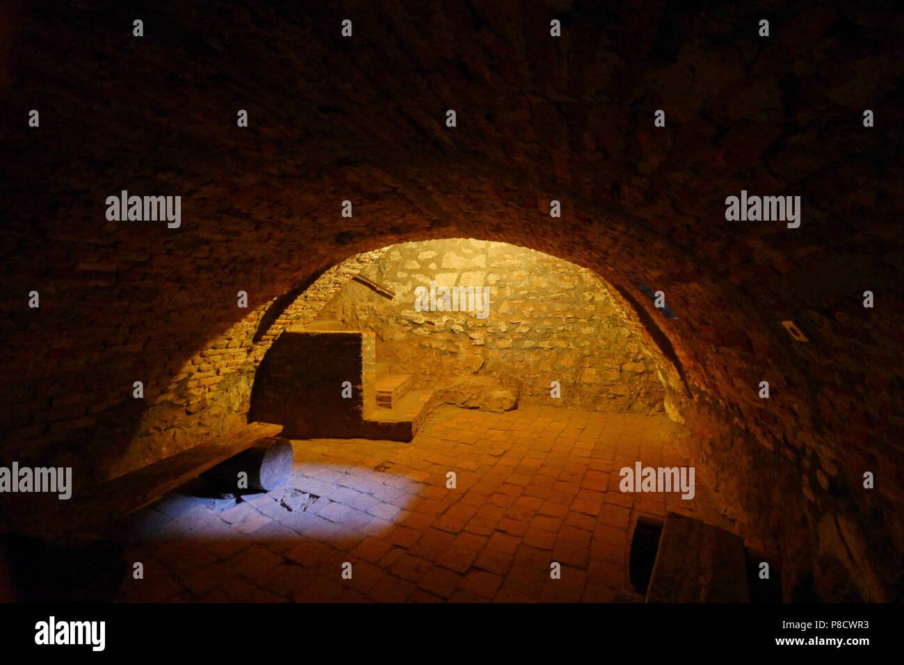 The room with a ceiling in the form of an arch with benches made of two ...