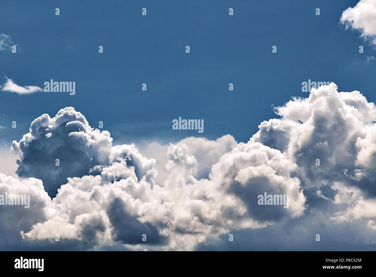 Deep volumetric landscape of the blue sky with huge piles of white ...
