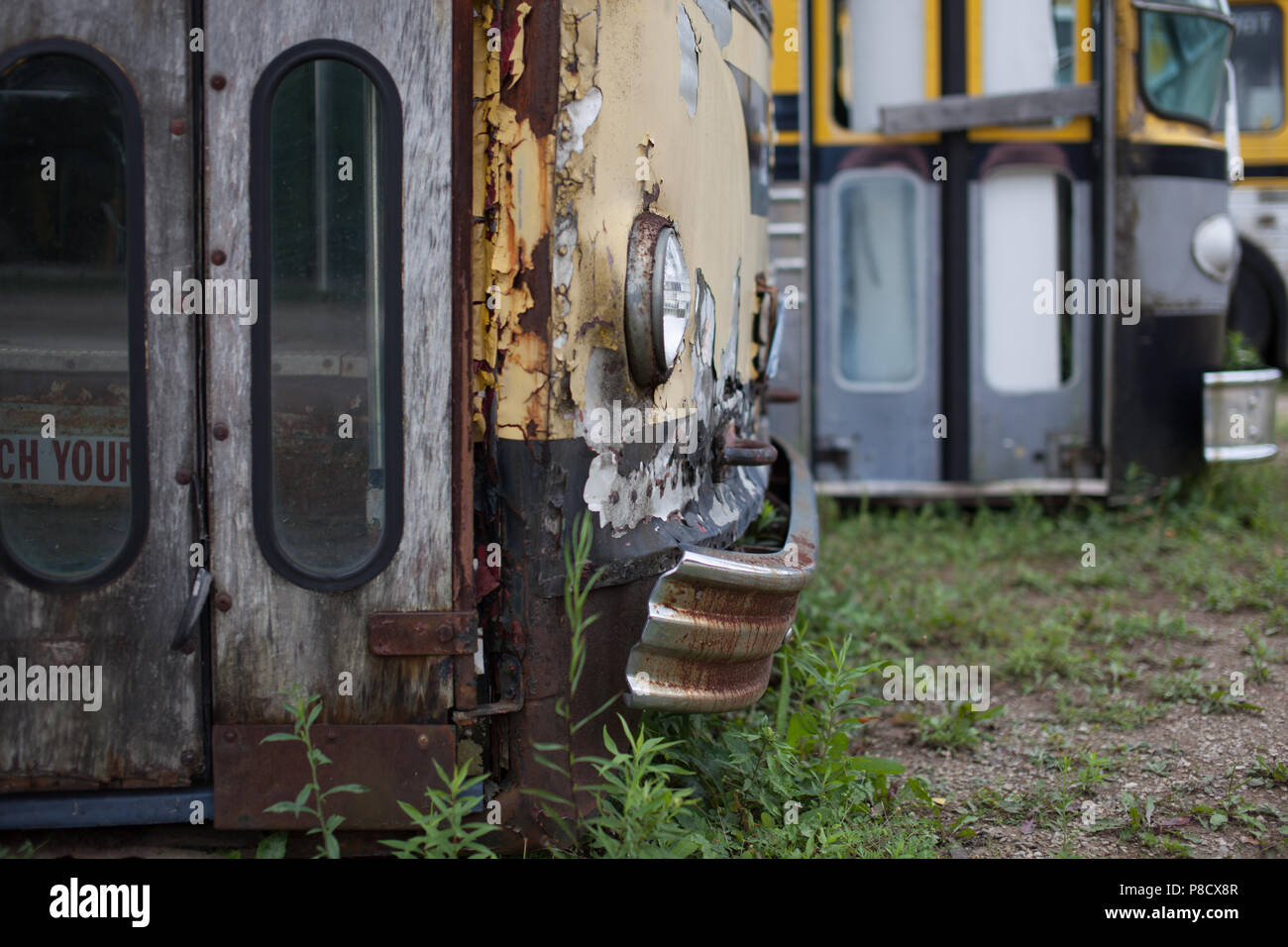 Decaying city buses are parked in a lot Stock Photo - Alamy