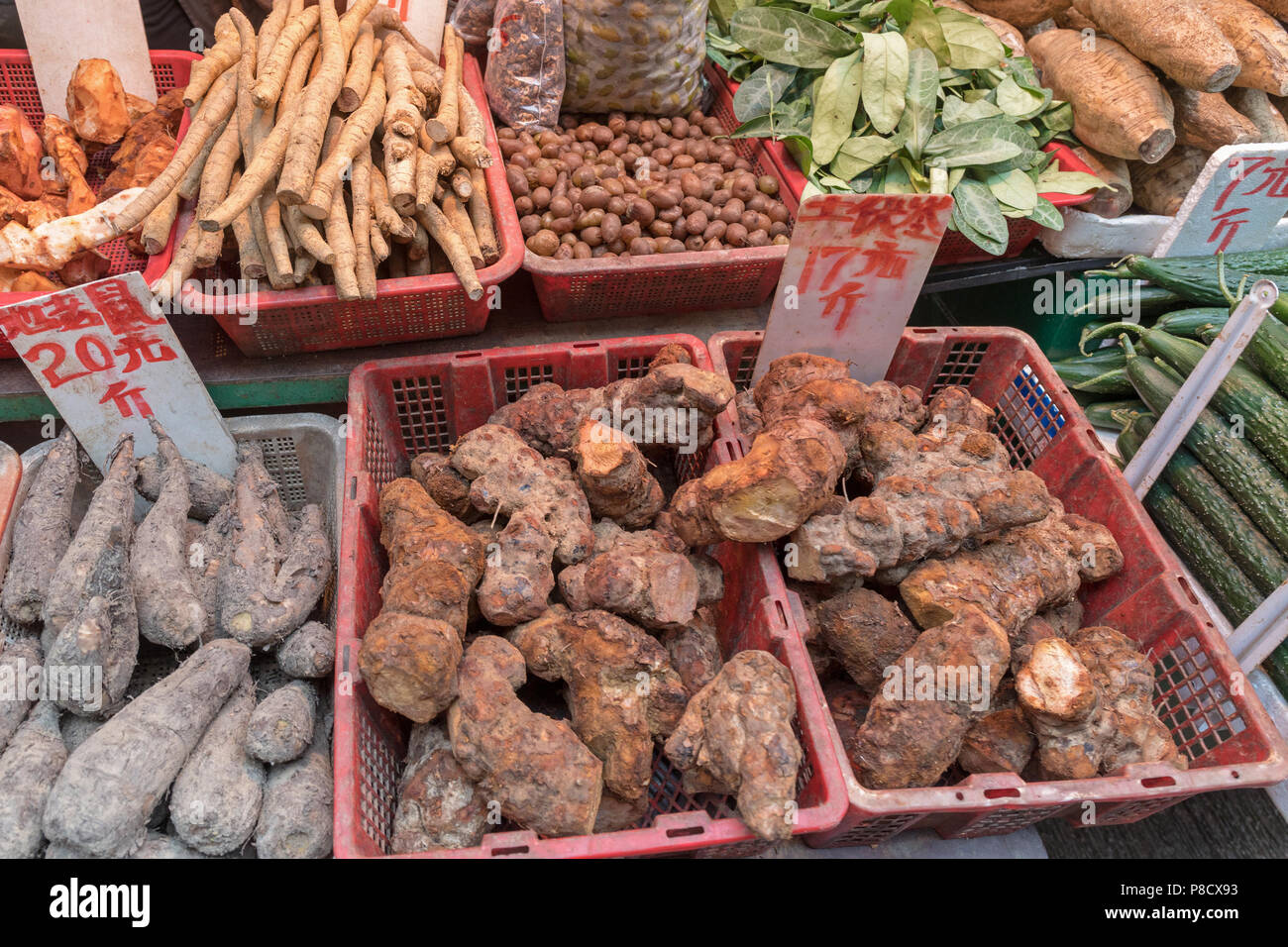 Potatoes and Roots Vegetables at Market Stall in China Stock Photo - Alamy