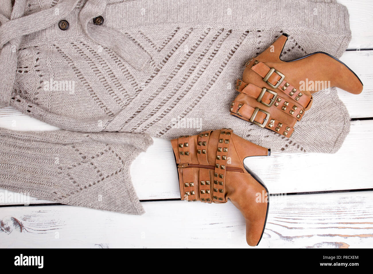 Flat lay close up brown heel boots and woolen coat Stock Photo - Alamy