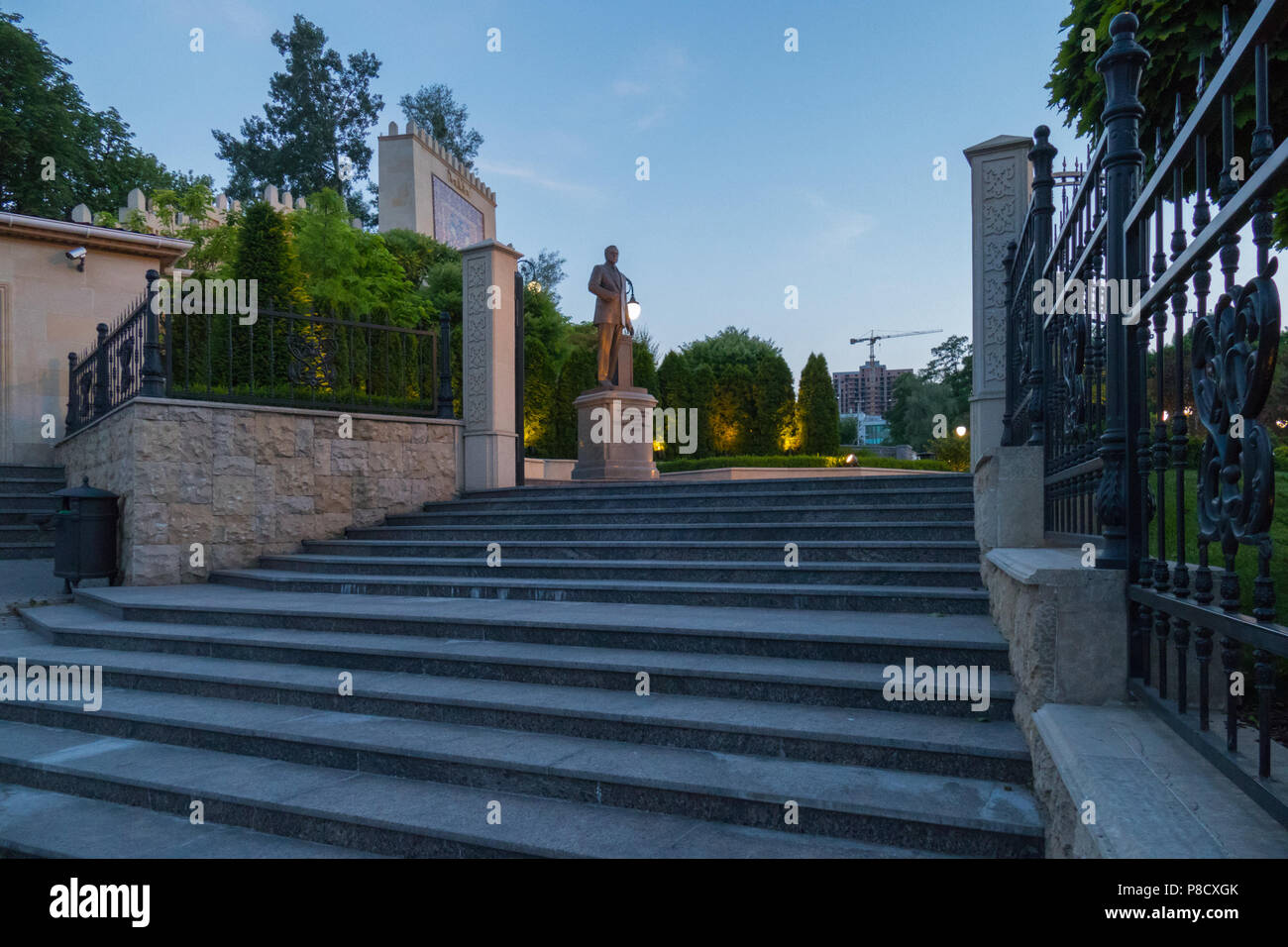 Steps with a forged fence on the way to the monument of a famous person ...