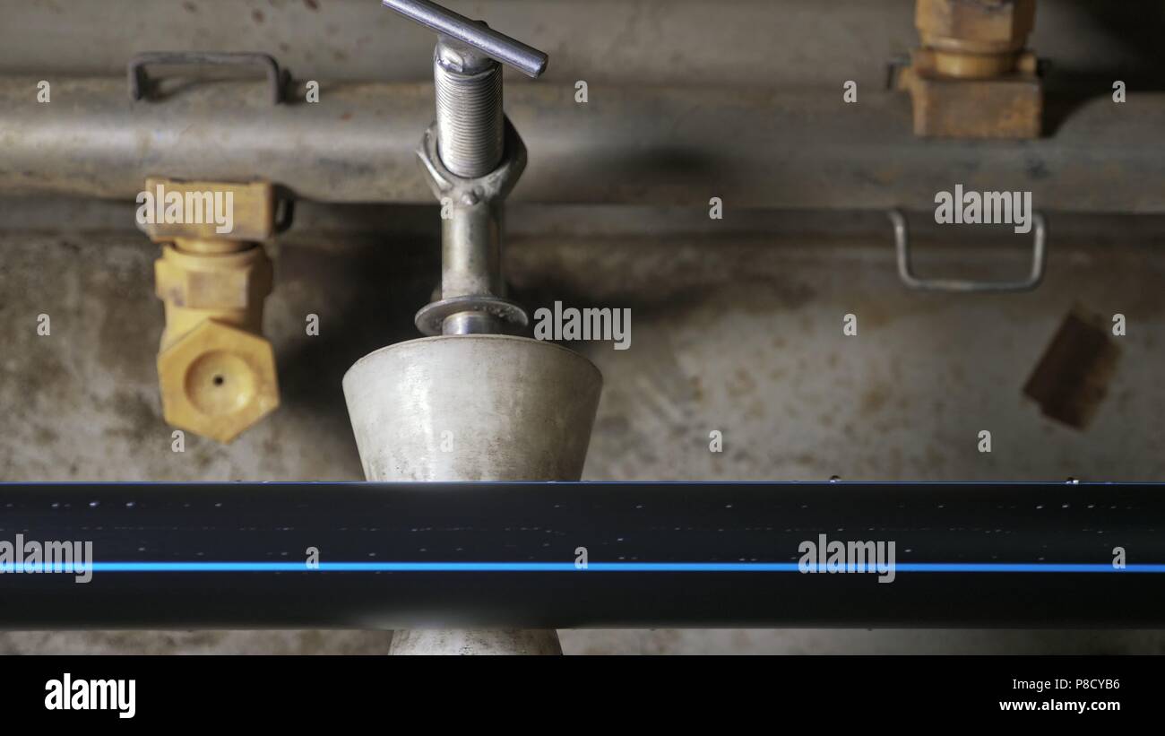 Pipes manufacturing production line. Manufacture of plastic water pipes ...