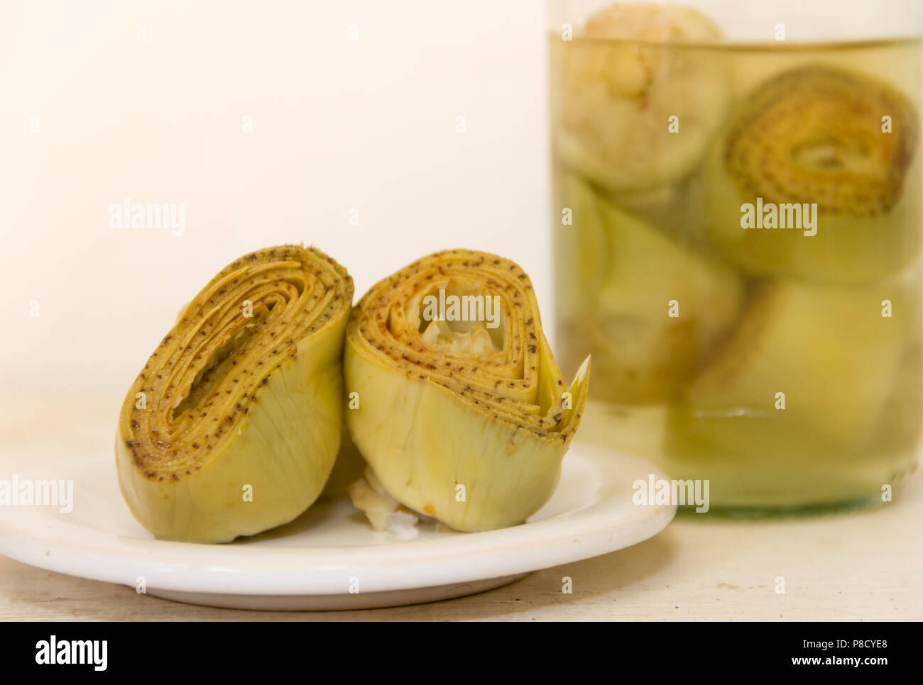 pickled heart of artichoke in vinegar Stock Photo - Alamy