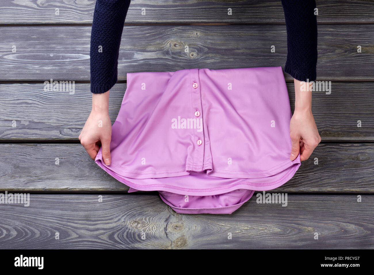 Woman female folding clothing clothes hi-res stock photography and images - Alamy
