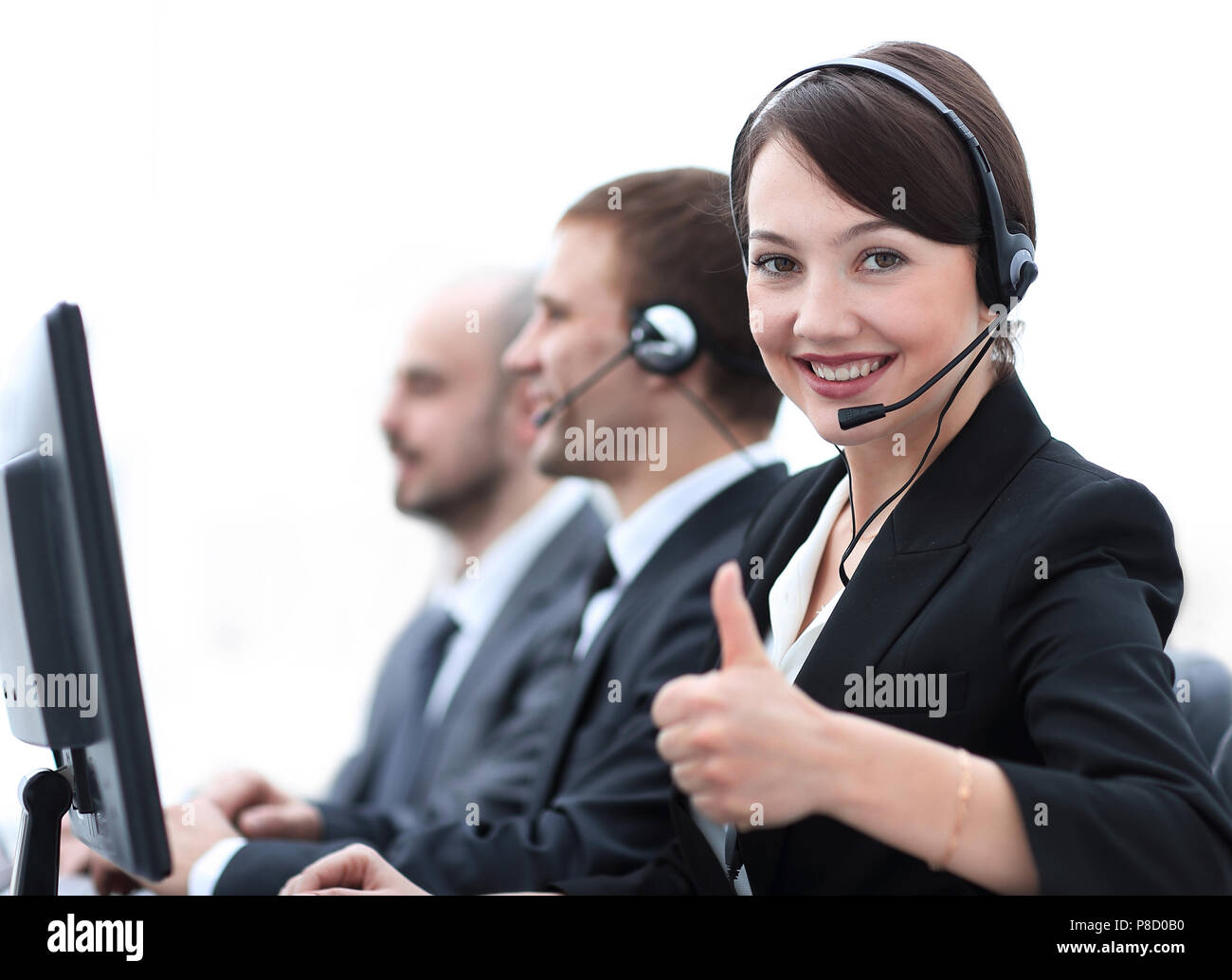 Manager of the call centre shows thumb up sitting at your Desk Stock ...