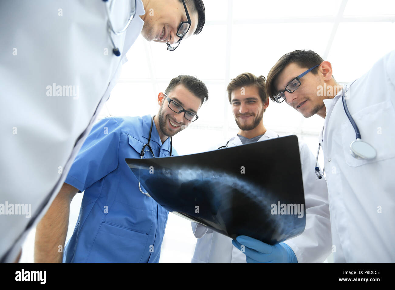 bottom view.team of doctors discussing an x-ray Stock Photo - Alamy