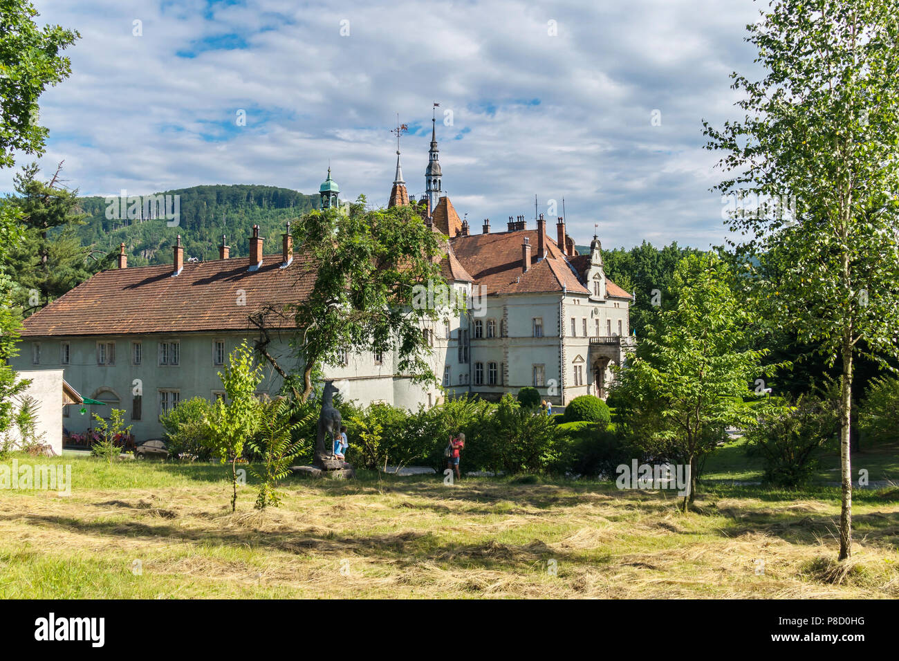 Beautiful old castle with a red roof against a backdrop of huge ...