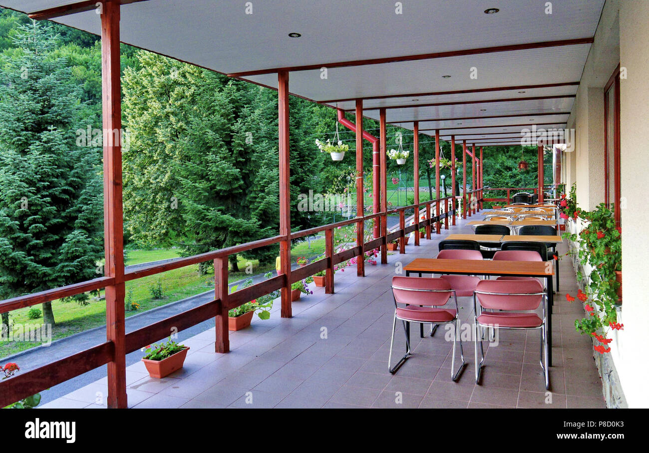 Summer terrace with tables and chairs with a beautiful view of the ...