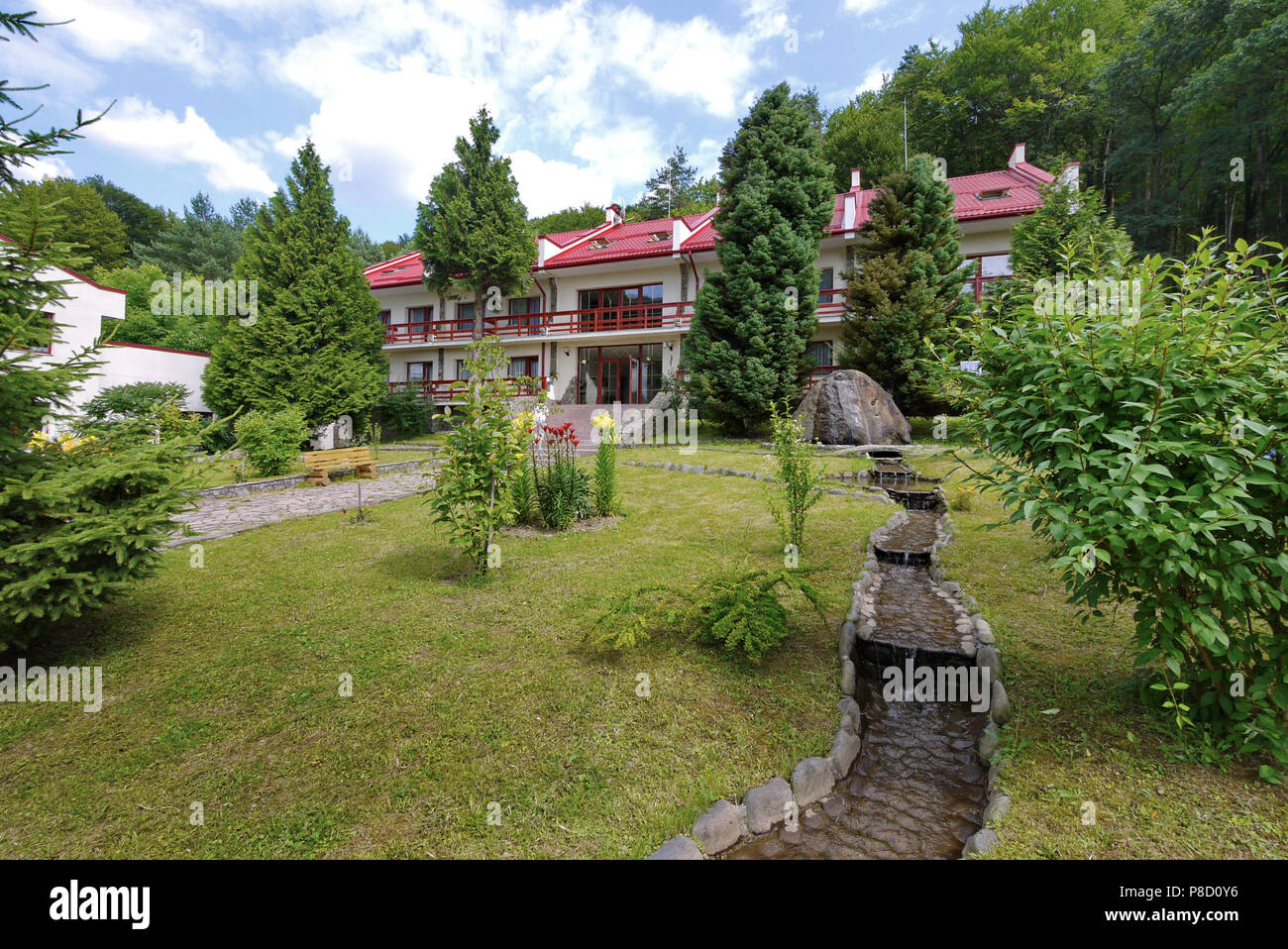Beautiful landscaped design in front of the hotel in a picturesque ...