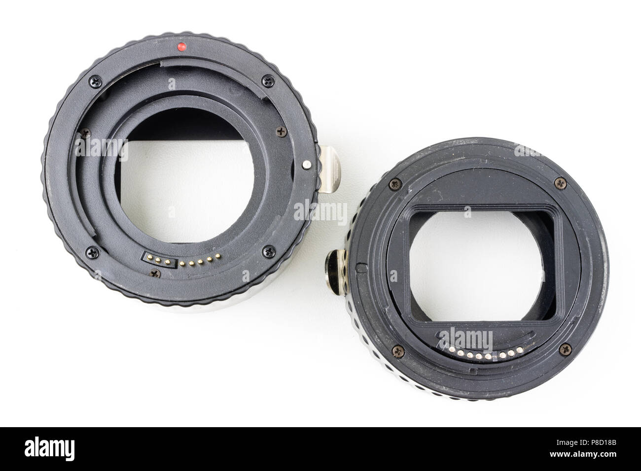 Intermediate ring for macro photography on a white table. Photo ...