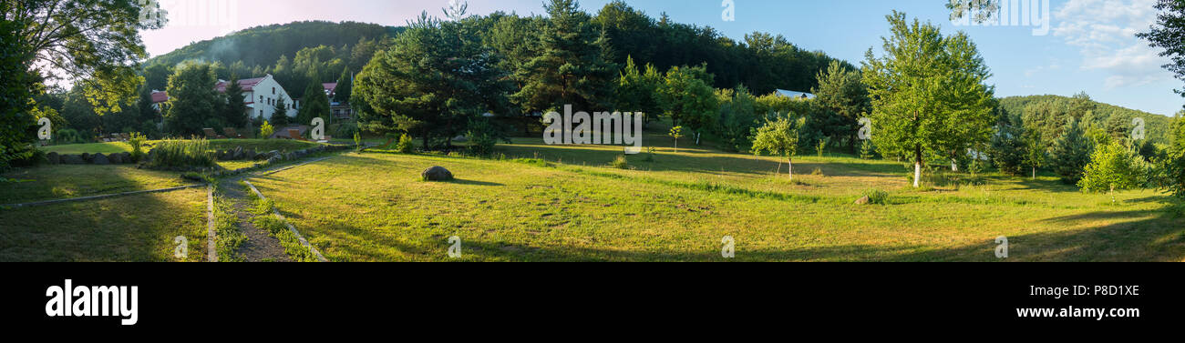 Panoramic view of the garden. In the background, the house is visible ...