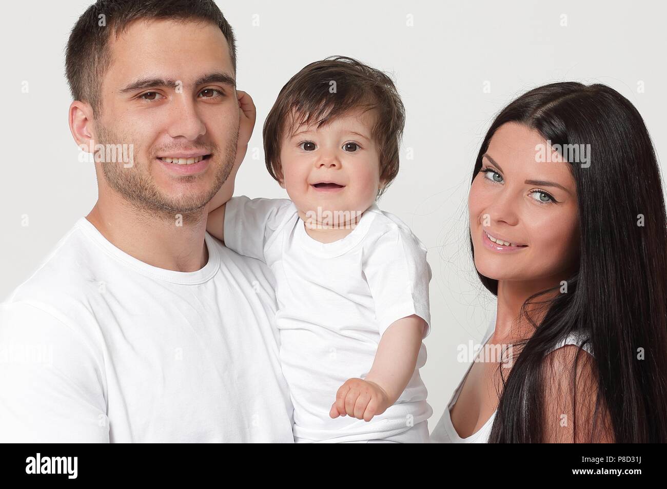 Happy family with newborn baby on a white background Stock Photo - Alamy