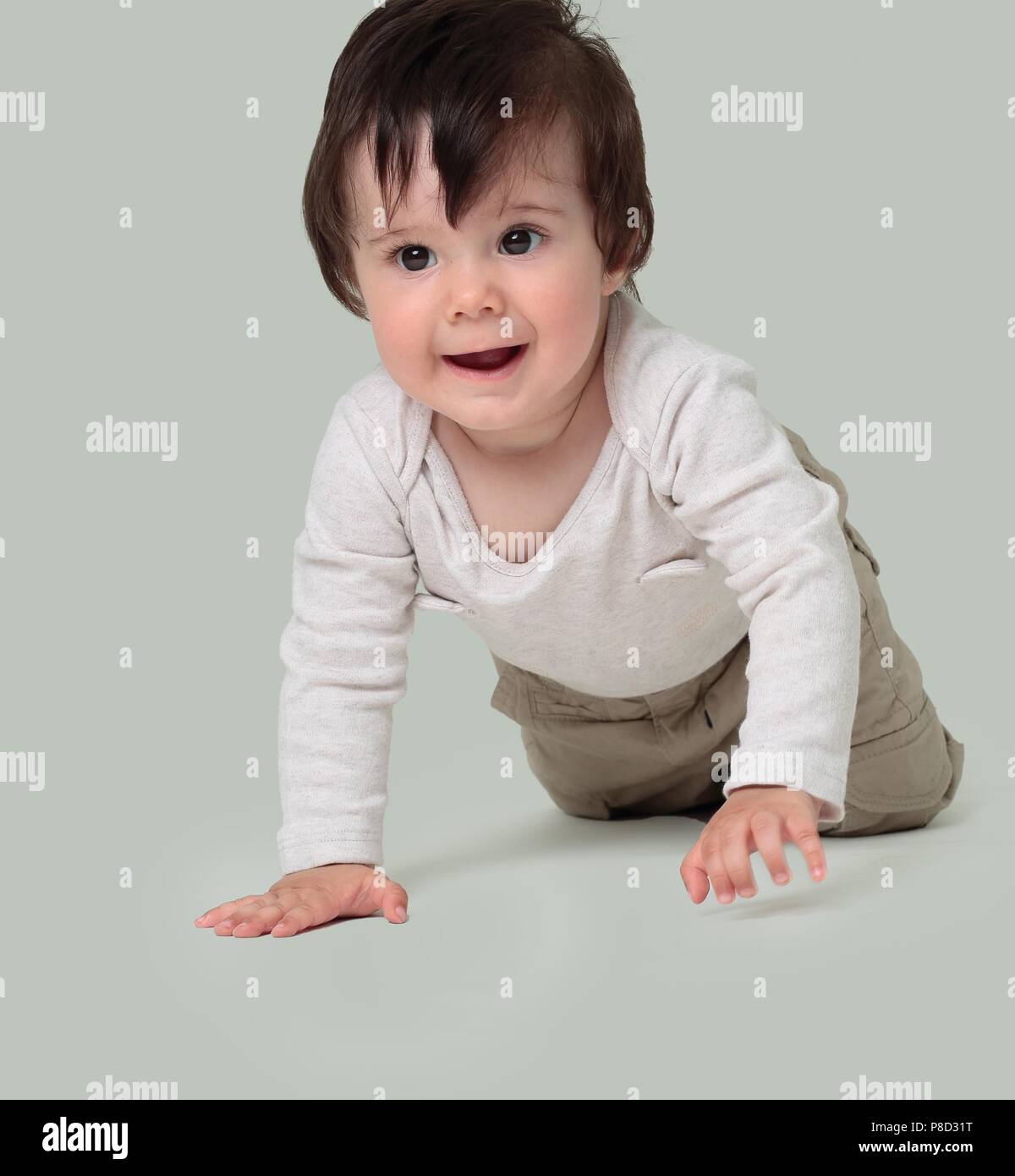 the baby learns to crawl isolated on white background Stock Photo - Alamy