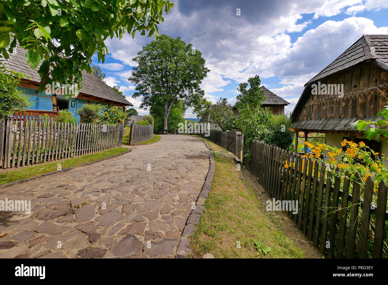 A winding street in a village with a paved stone path . For your design ...
