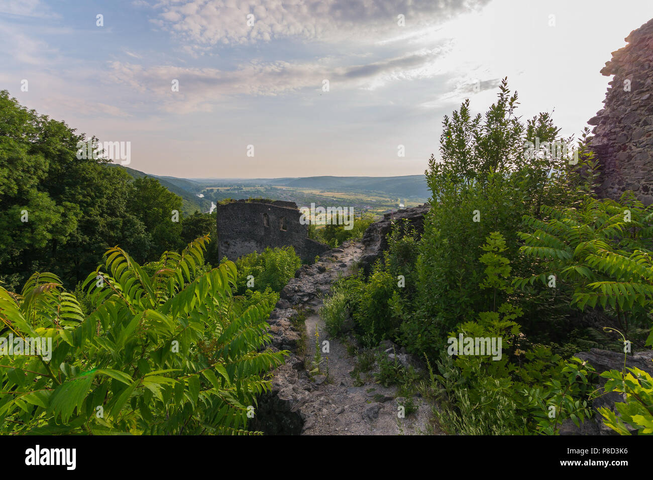 Stone road leading to the ruins of an ancient fortification wall ...