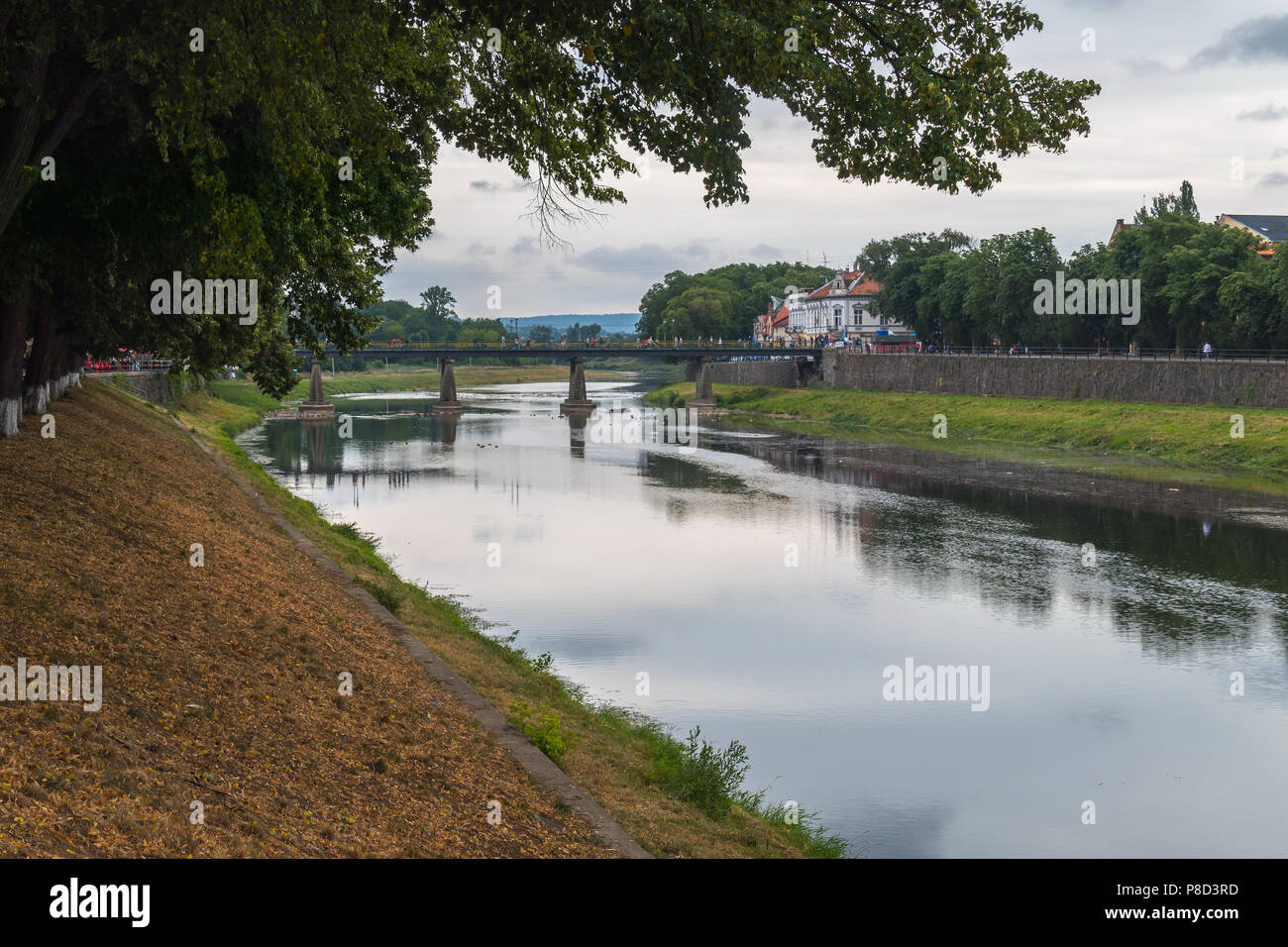 A wide bridge across the river channel, connecting the two banks with ...