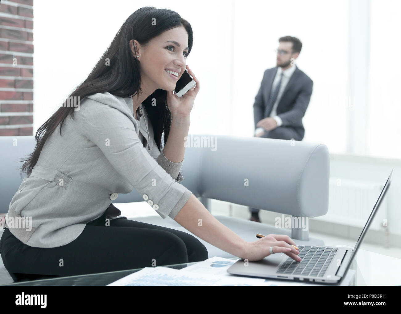 Woman assistant at the workplace in the office Stock Photo - Alamy