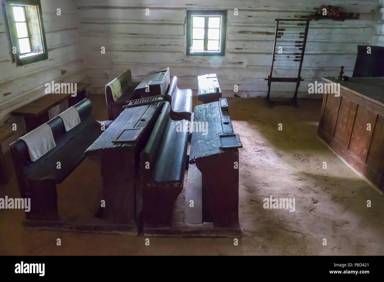 Museum exposition of the classroom with ancient wooden desks and ...