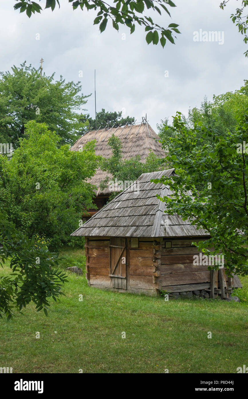 an old wooden stables in the courtyard near the same house, covered ...
