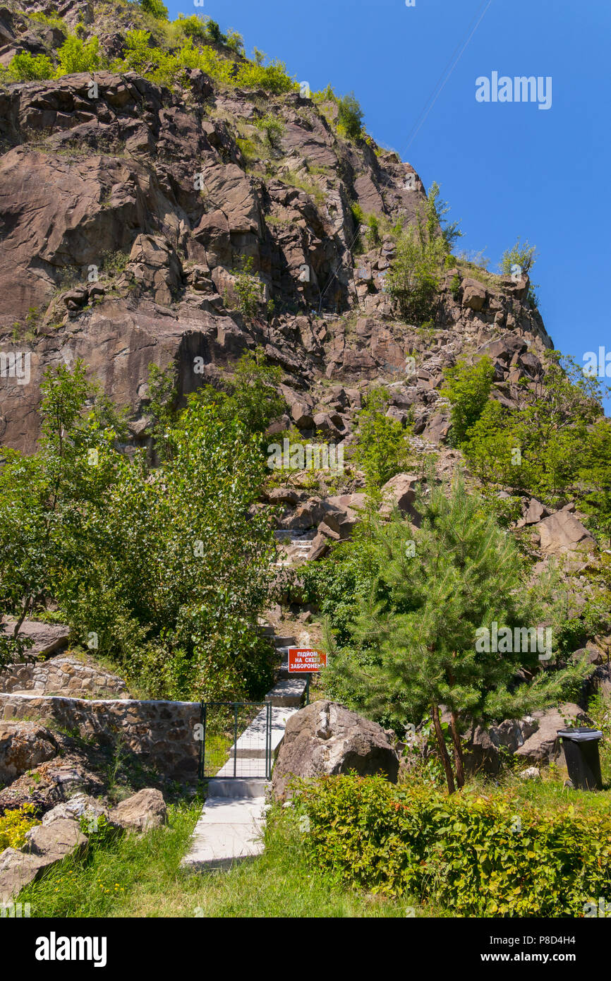 Steep steps leading to the top of a rocky mountain against a backdrop ...