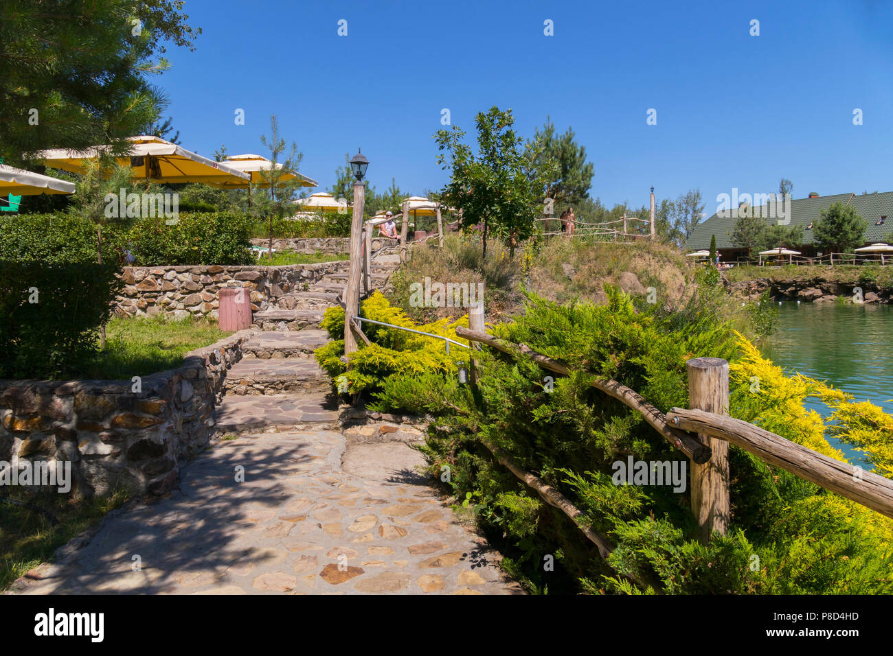 Stone steps with a wooden fence leading to a recreation area against ...