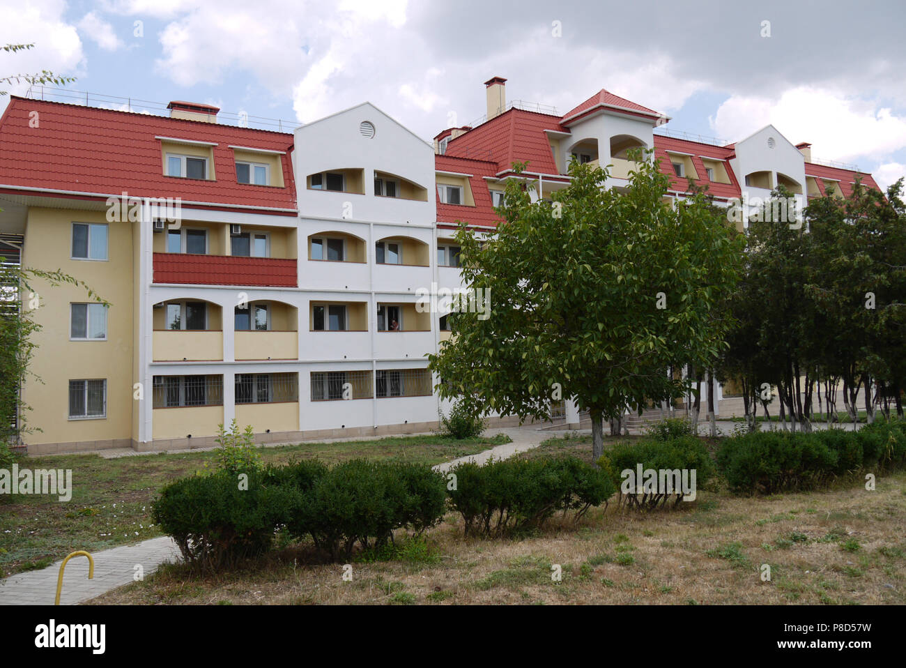 multistory hotel with a red roof and mansard windows for holidaymakers ...