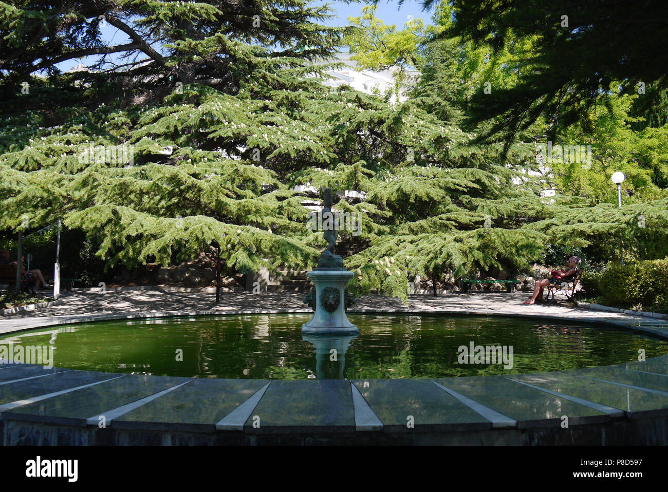 Recreation area with a huge fountain with a stone sculpture in the ...