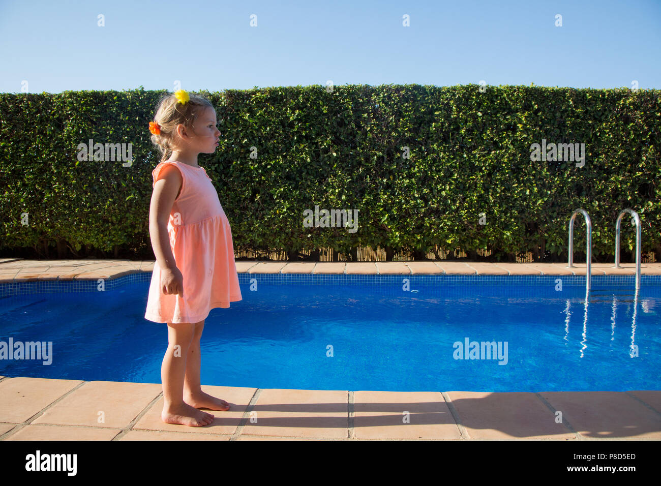 Girl in colourful garden hi-res stock photography and images - Alamy