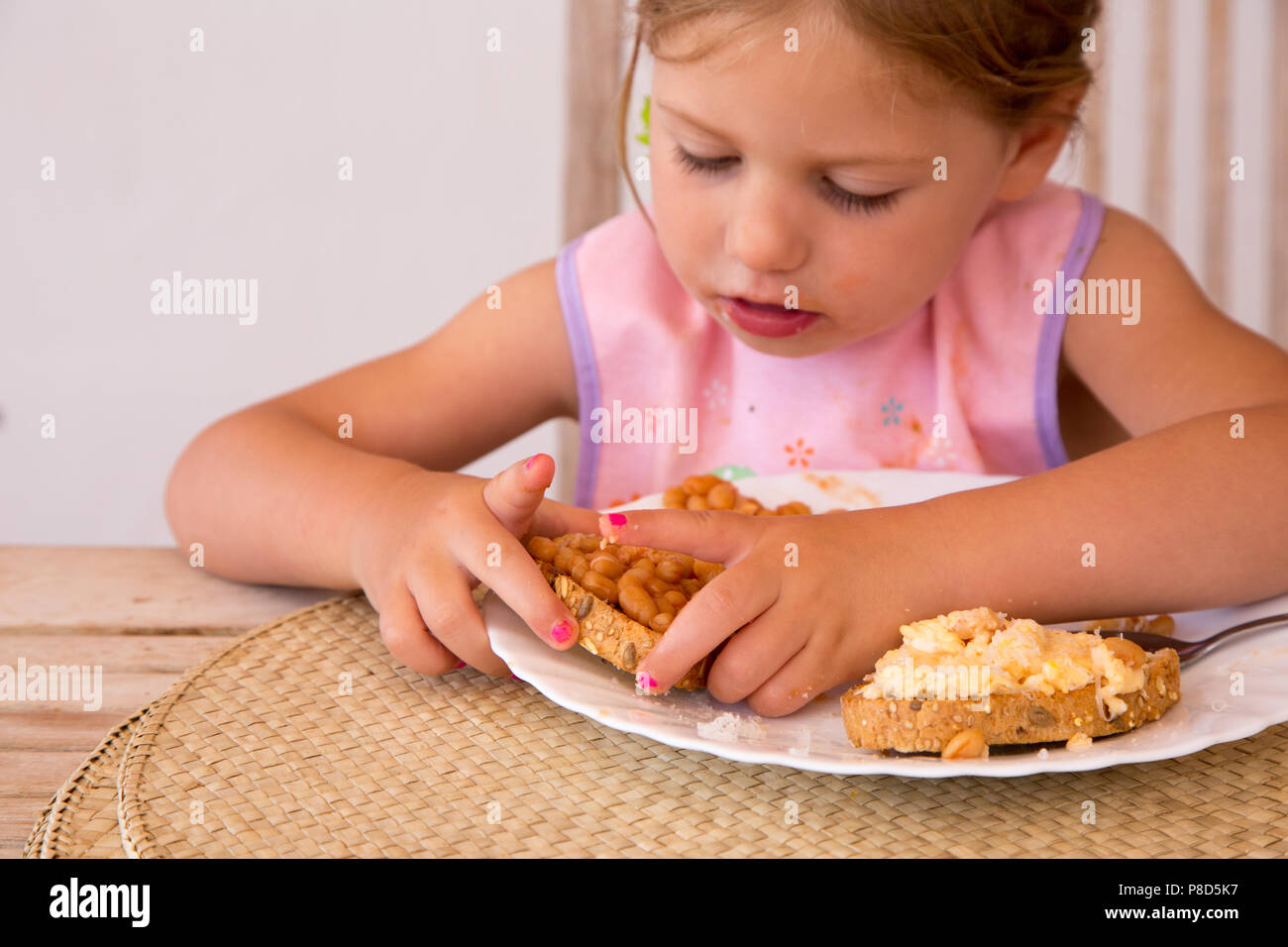 Girl eating baked beans hi-res stock photography and images - Alamy