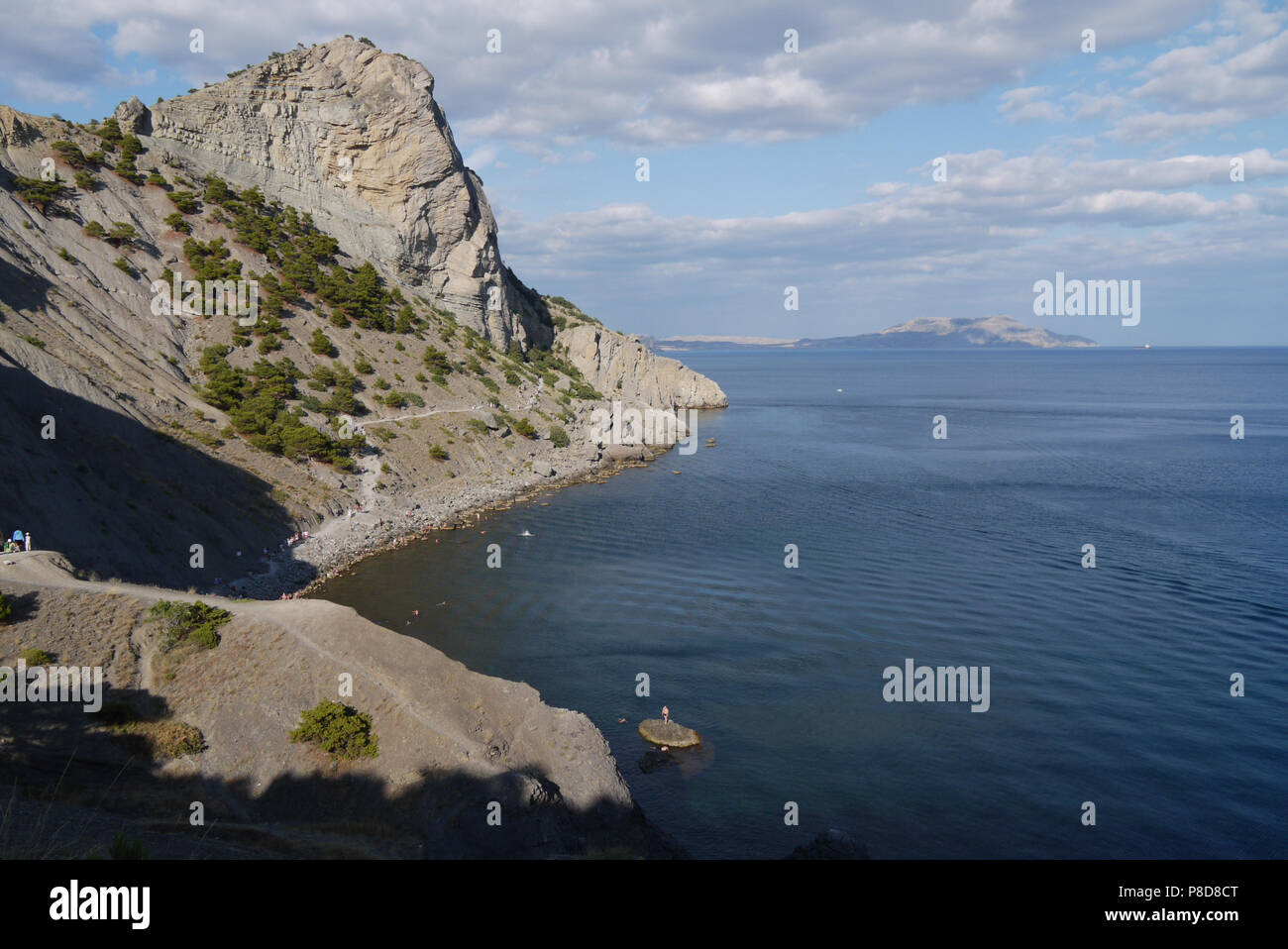 Beautiful grass-covered coastal slopes on the background of a vast ...