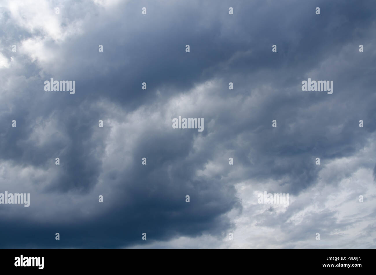 Background blue sky with gray cumulus clouds Stock Photo - Alamy