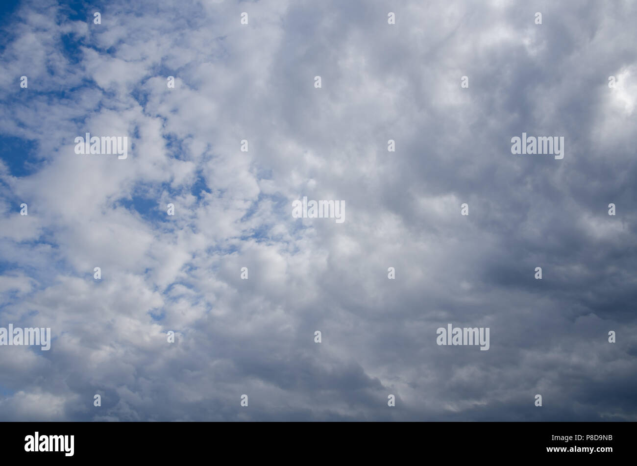 Background blue sky with gray cumulus clouds Stock Photo - Alamy