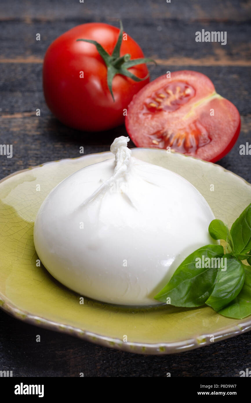 Fresh soft white burrata, ball buttery cheese, made from a mix of ...