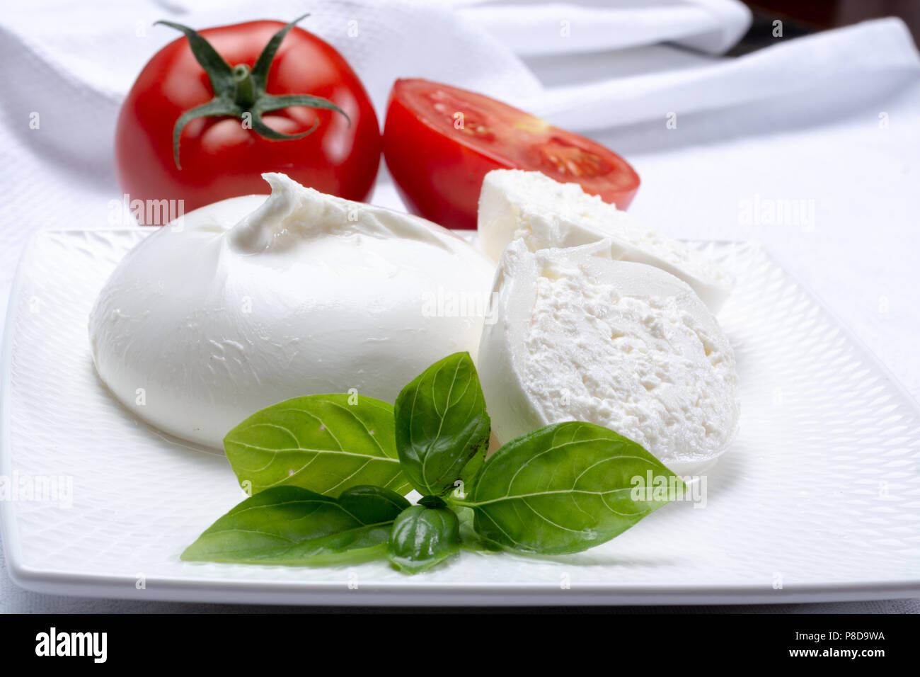 Fresh soft white burrata, ball buttery cheese, made from a mix of ...