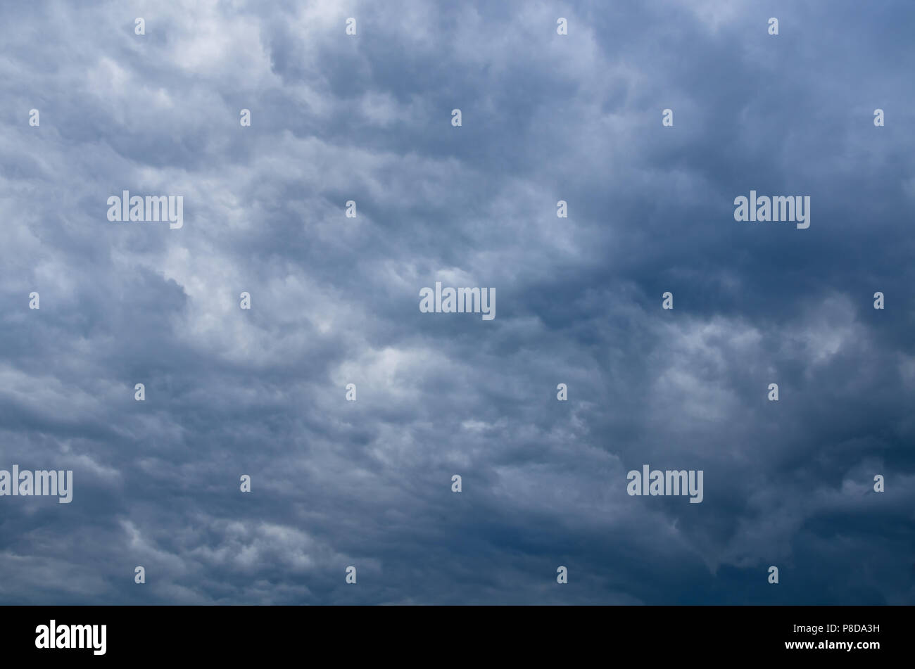 Background blue sky with gray cumulus clouds Stock Photo - Alamy