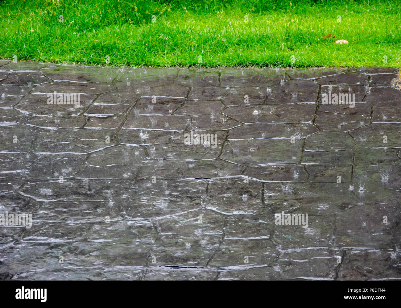 Rain falls on the street floor Stock Photo - Alamy