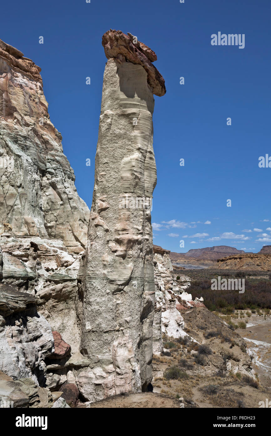 UTAH - Boulder perched on an eroded base rock marks the entrance to the ...