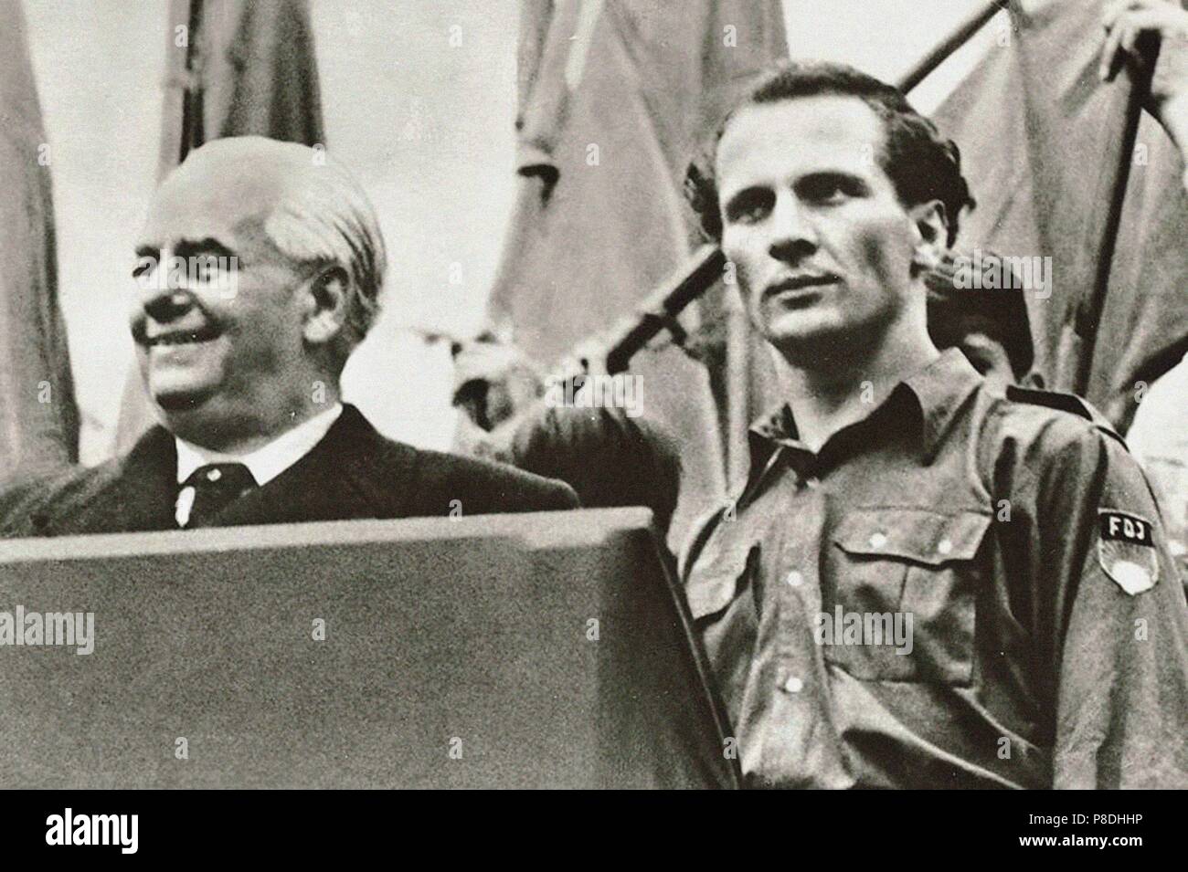 The FDJ chairman Erich Honecker stands next GDR president Wilhelm Pieck ...