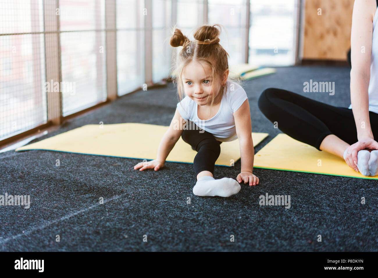Little girl does exercises hi-res stock photography and images - Alamy