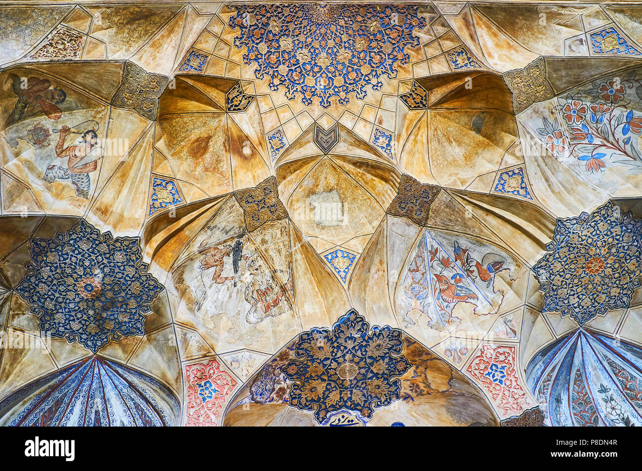 KERMAN, IRAN - OCTOBER 15, 2017: The carved arabesques and painted ...
