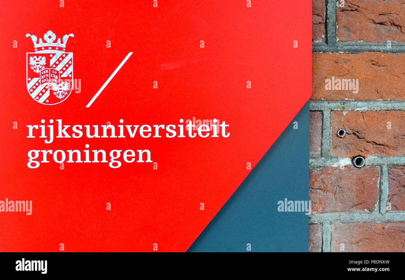 The logo of the university at the main building in Groningen ...