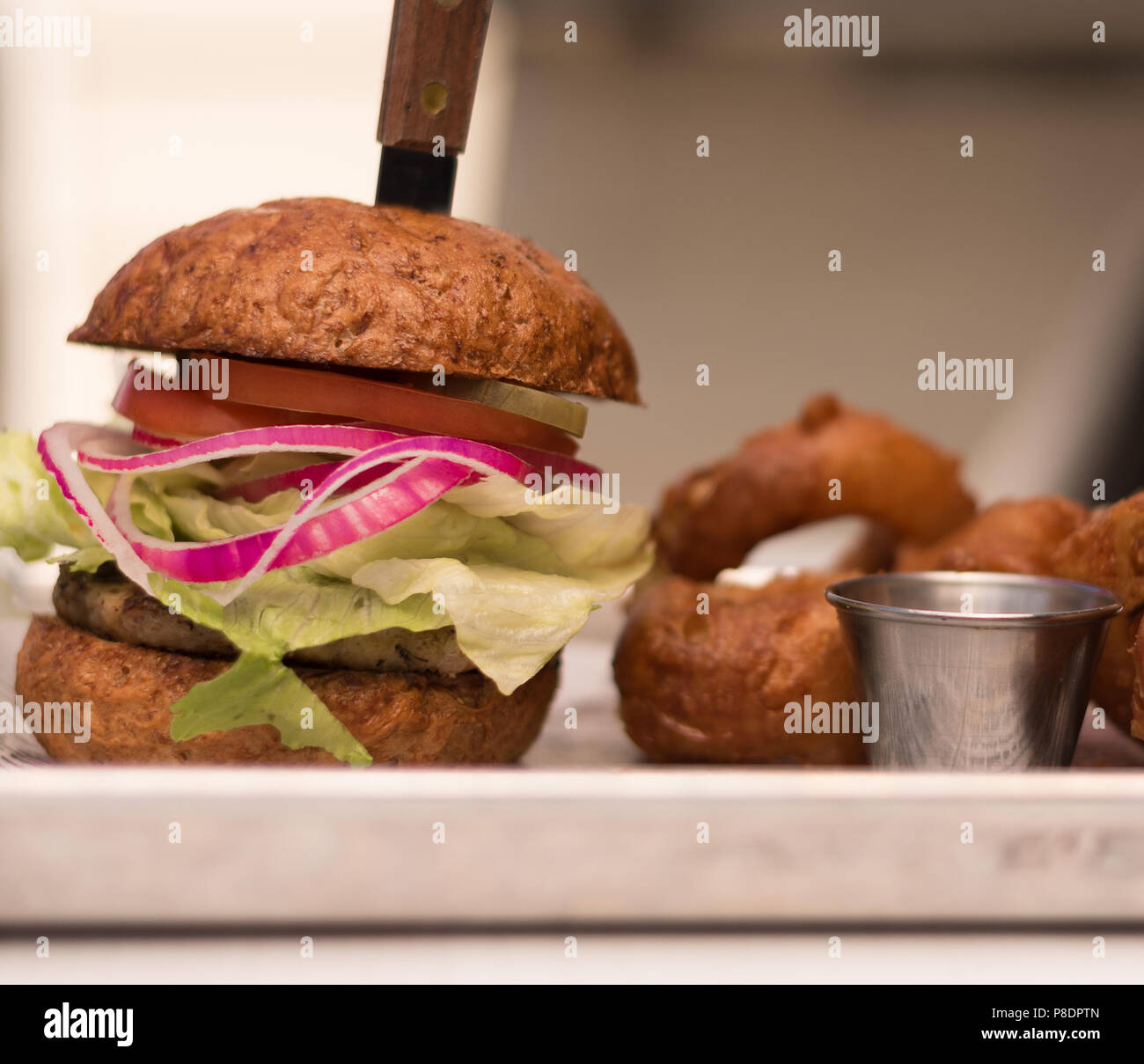 Grilled Chicken Sandwich and Onion Rings Stock Photo - Alamy